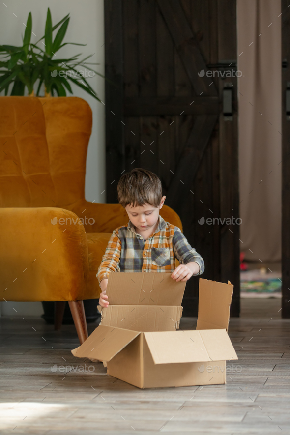 Little boy play with a box at home Stock Photo by Masson-Simon | PhotoDune