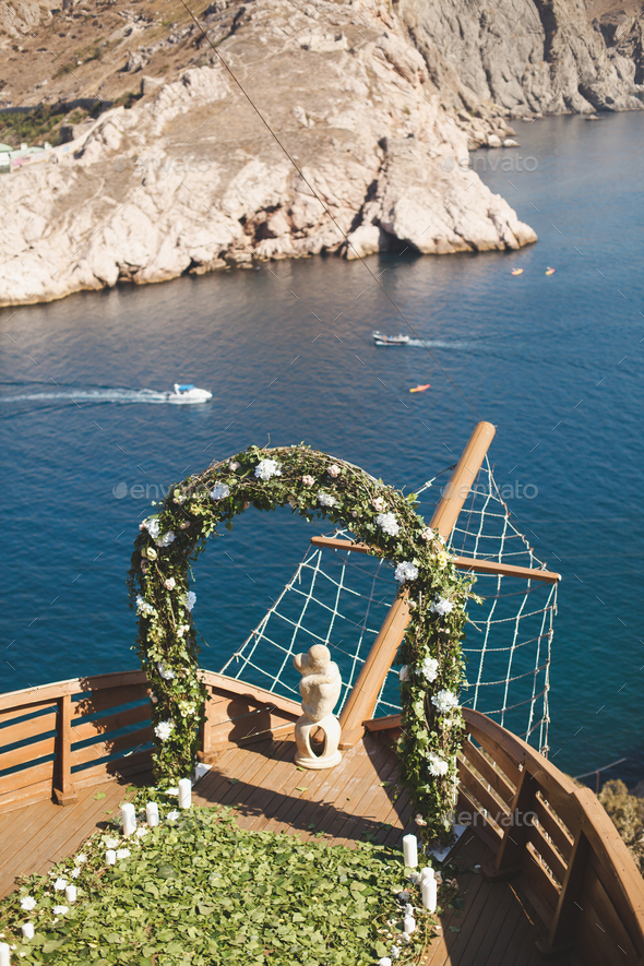 Luxurious wedding ceremony on a ship with a view of the sea and ...