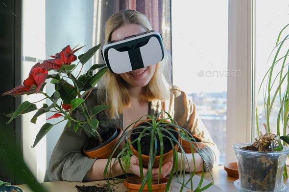 Gardening.Virtual world, metaverse.Girl planting flowers in immersive ...