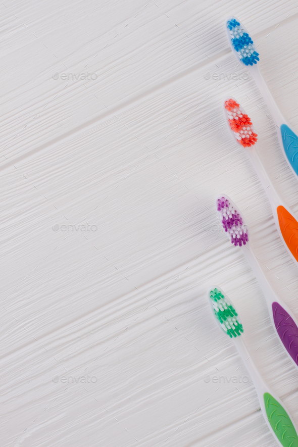 Side border of colorful toothbrushes Stock Photo by stockfilmstudio