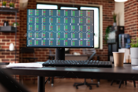 Close up computer with stock market numbers in business office Stock ...