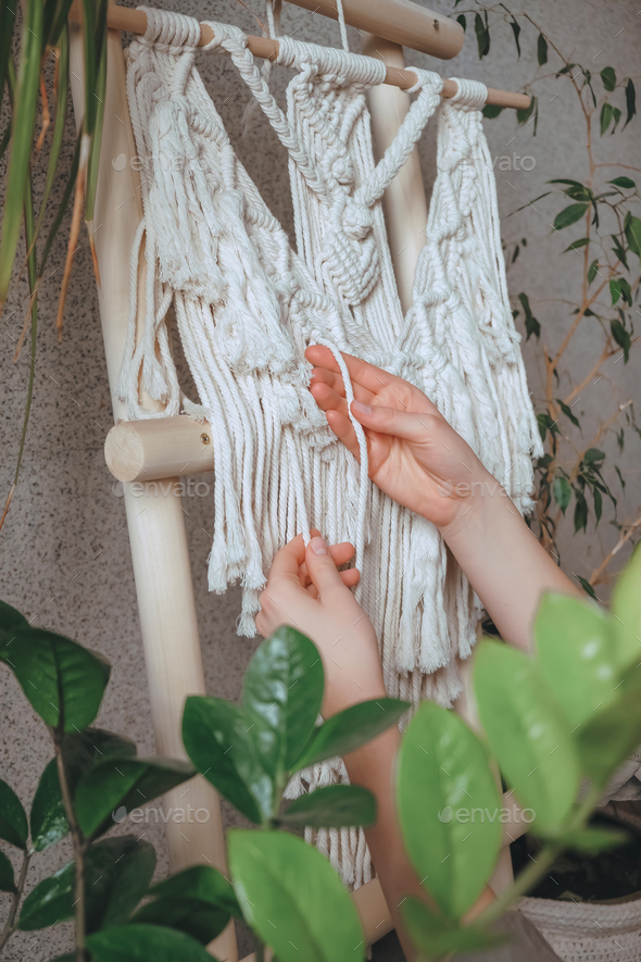 Macrame.Woman weaves home decor from cotton thread macrame pattern ...