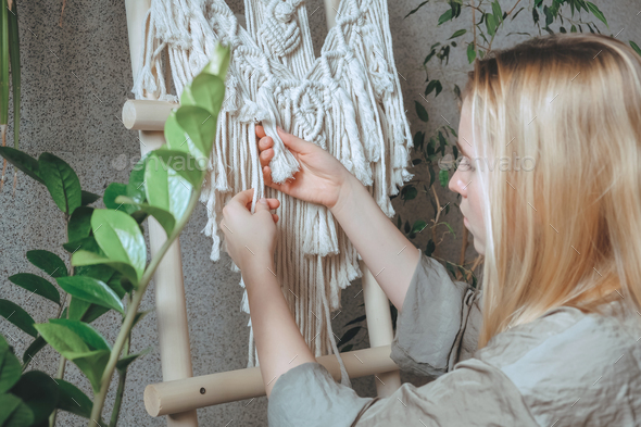 Macrame.Woman weaves home decor from cotton thread macrame pattern ...