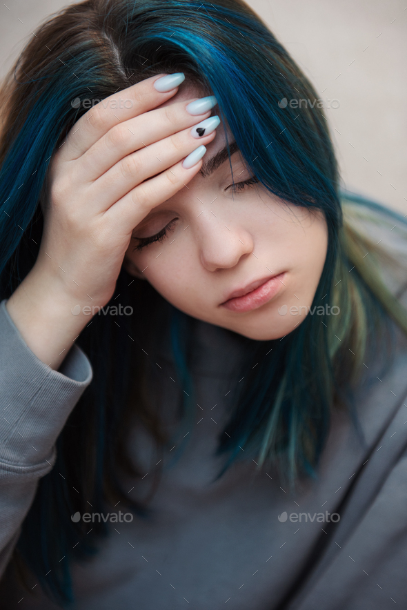 A teenage girl with blue hair is sad and depressed Stock Photo by Olena ...