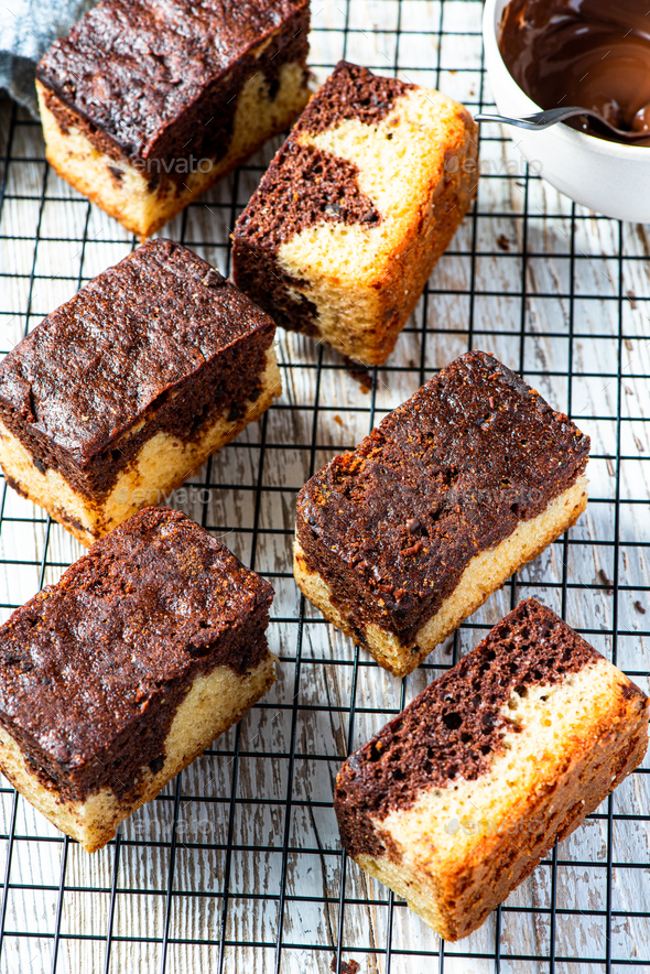 Chocolate marble cake. Slices on tray and wooden table Stock Photo by ...