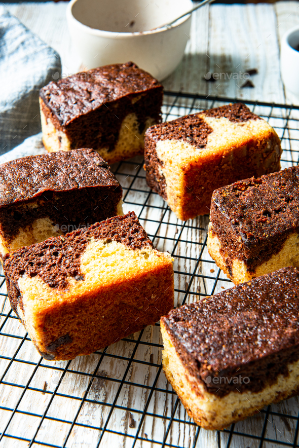 Chocolate marble cake. Slices on tray and wooden table Stock Photo by ...