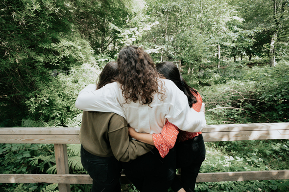 Three woman hugging each other, love and affection concept, forest ...