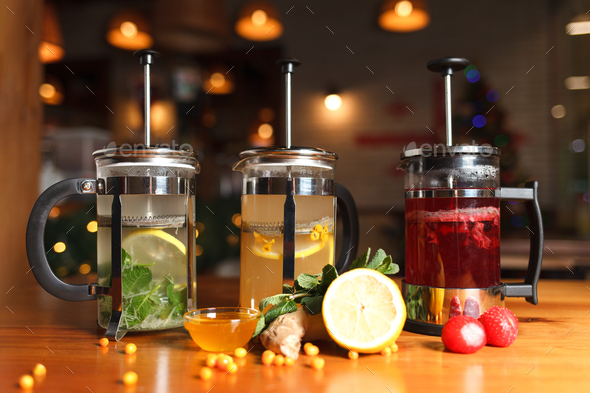 Many teapots with brewed fruit teas with different flavors. Natural ...