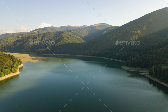 Aerial view of big lake with clear blue water between high mountain ...
