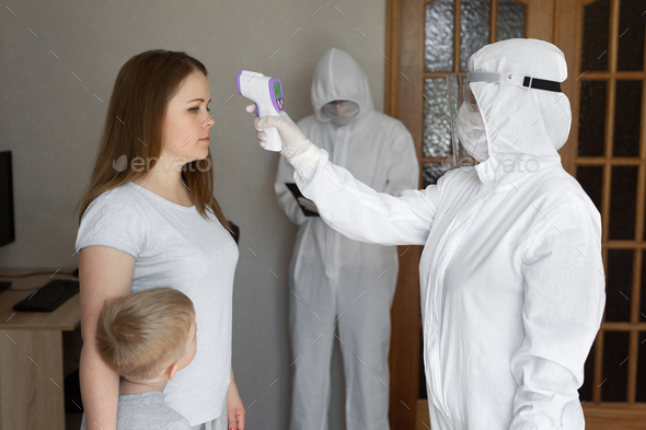 Doctor check patient body temperature using infrared forehead ...