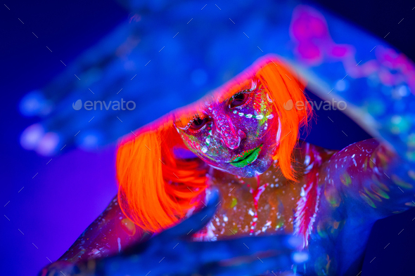 Neon Woman dancing. Fashion model woman in neon light, portrait of ...