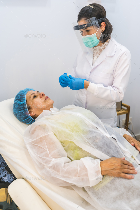 Preparing injections for platelet-rich plasma treatment for a client's ...