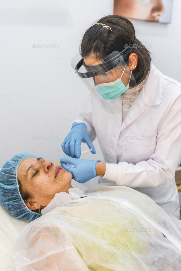 Preparing injections for platelet-rich plasma treatment for a client's ...