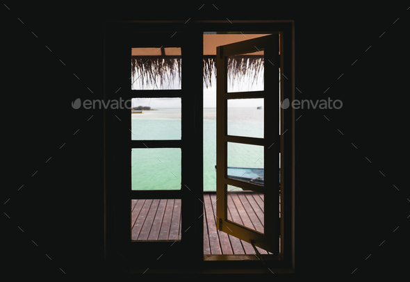 View of seascape from partly opened window of a shack Stock Photo by ...