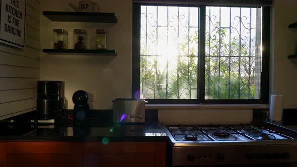 Cinematic Indoors Shot of a Kitchen Panning Through Window Revealing a ...