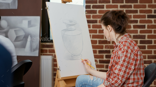 Creative woman using pencil to sketch contemporary drawing Stock Photo ...
