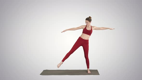 Woman Practicing Yoga, Standing in Extended Side Angle Exercise ...