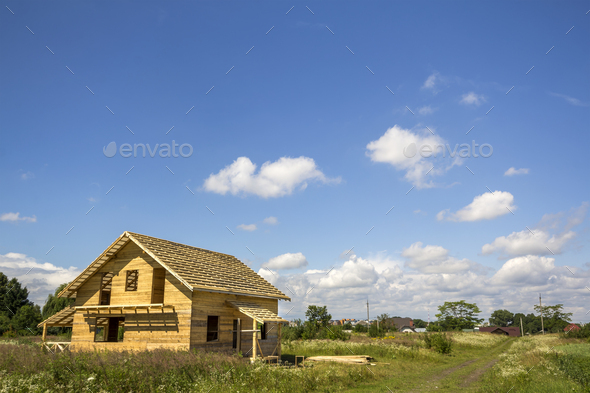 New wooden ecological not finished cottage from natural materials under ...