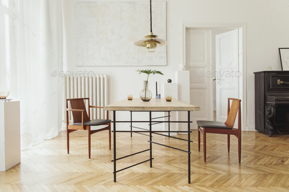 Stylish and modern dining room interior with design sharing table and ...