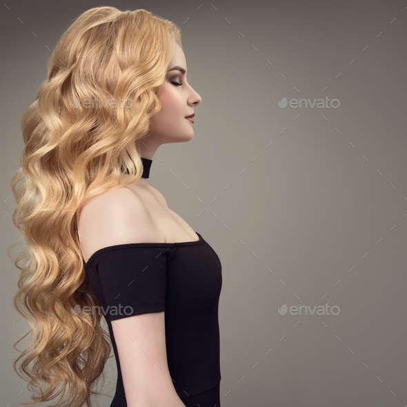 Blonde Woman With Long Curly Beautiful Hair. Side View. Stock Photo by ...