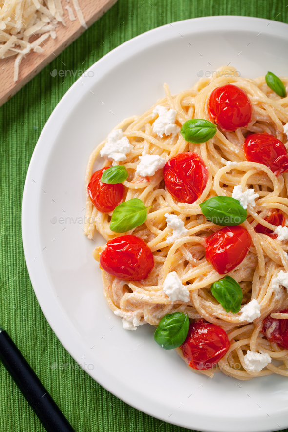 Spaghetti with cherry tomatoes and ricotta Stock Photo by foodstock