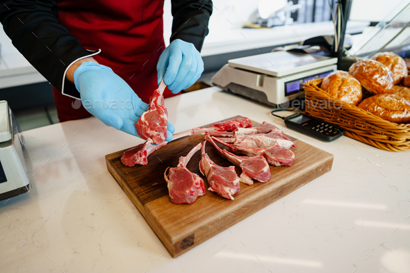 Close up of a butcher setting raw lamb ribs in a butcher shop Stock ...