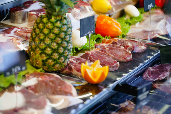 Fresh raw good quality meat on counter in Butcher shop Stock Photo by ...