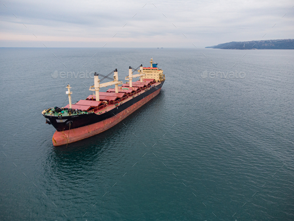 Large general cargo ship, Top down aerial view. Stock Photo by Sandsun