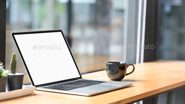 Side view laptop computer isolated screen on wood table. Stock Photo by ...