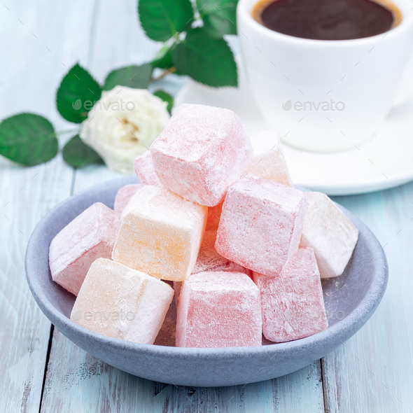 Turkish delight or lokum confection rose and lemon flavored with cup of ...