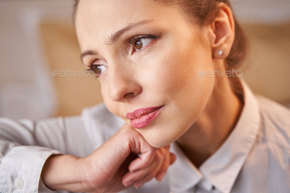 Calm pensive sad dreamy lady staring into distance Stock Photo by Iakobchuk