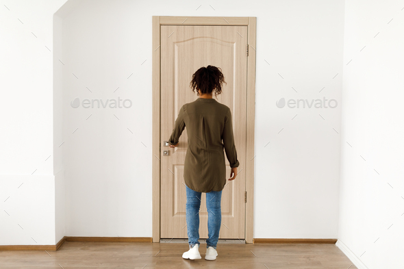 Back View Of Black Female Opening Apartment Door Standing Indoor Stock ...