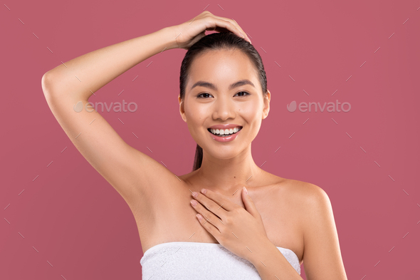 Cheerful japanese woman showing her clean and hairless armpit Stock ...