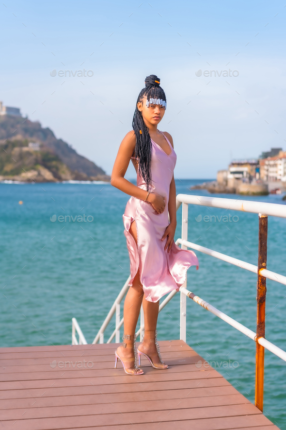 Beautiful Dominican ethnic girl with braids with a beautiful pink dress ...