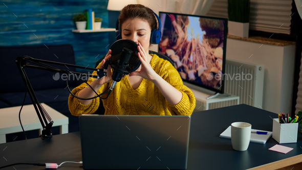 Creative influencer with headphones preparing to speak with fans Stock ...