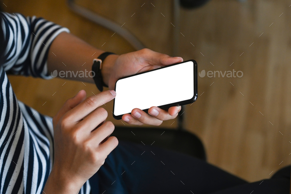 Close up view of young man hand pointing on screen of smart phone ...