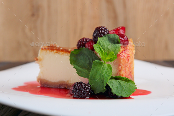 Piece of cheesecake with cherry, strawberry and dewberry Stock Photo by ...