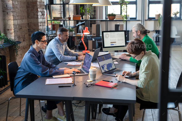 Business people using computers at work Stock Photo by AnnaStills ...