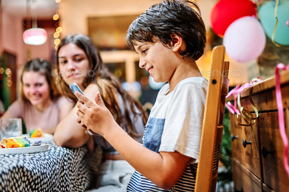Happy extended family celebrating birthday Stock Photo by Stockphoty