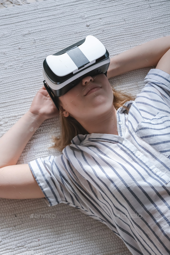 VR relax.European girl using virtual reality to relax and de-stress at ...
