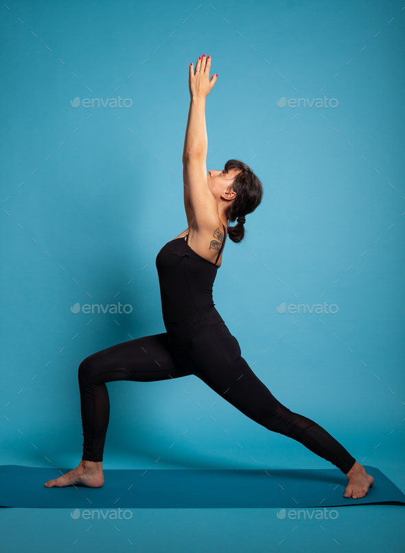 Woman trainer stretching legs muscles working at wellbeing Stock Photo ...