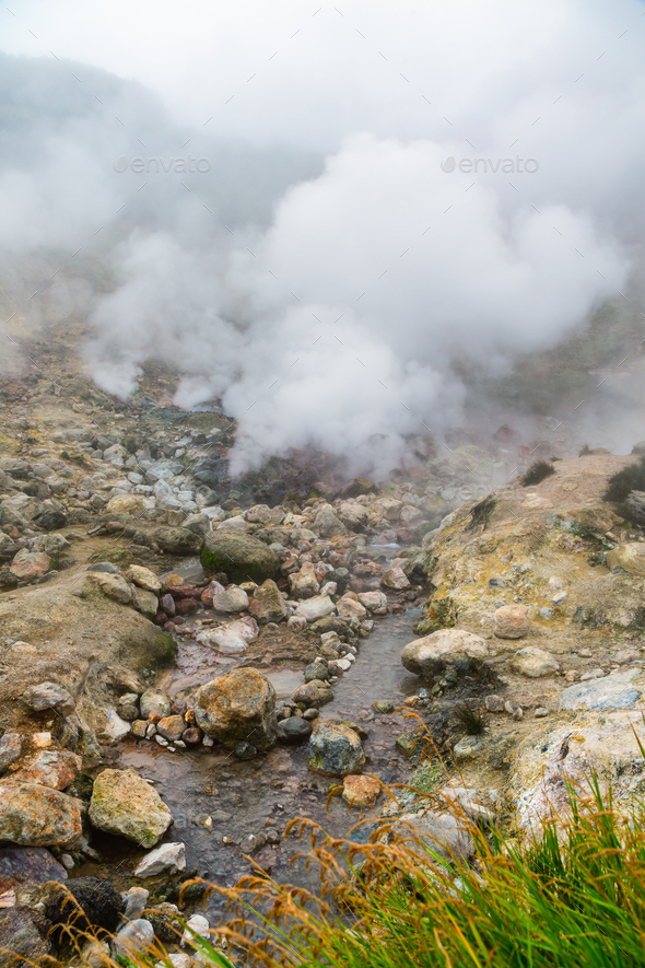 Breathtaking view of volcanic landscape, hot springs in crater of ...