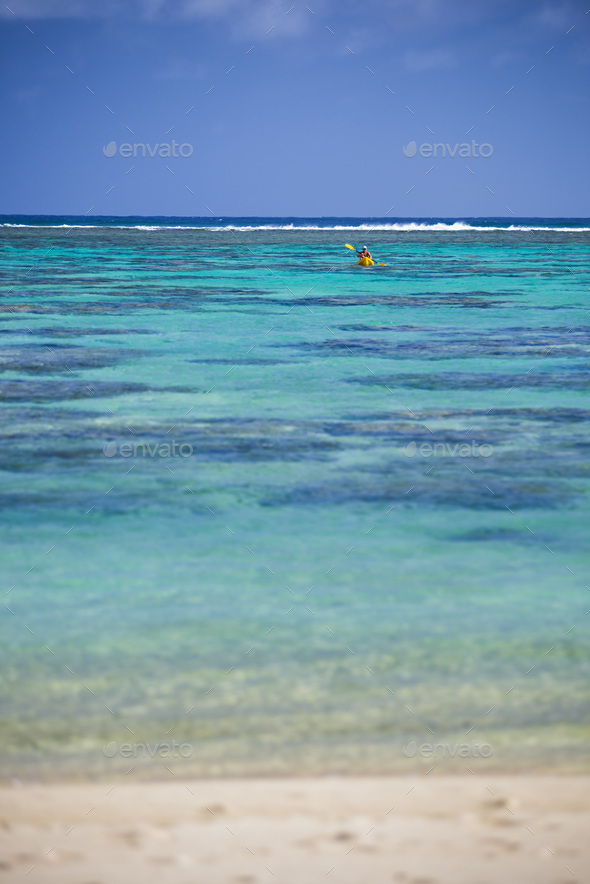 Kayaking in the beautiful blue tropical ocean of Titikaveka Lagoon ...