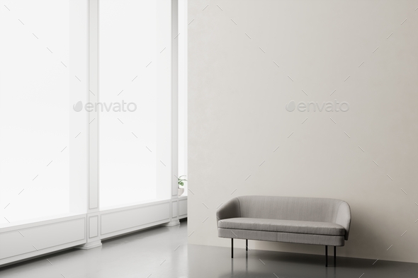 A bright white hall with large windows and a simple small sofa at the ...