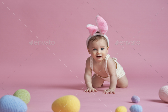 Portrait of crawling little baby wearing bunny costume Stock Photo by ...