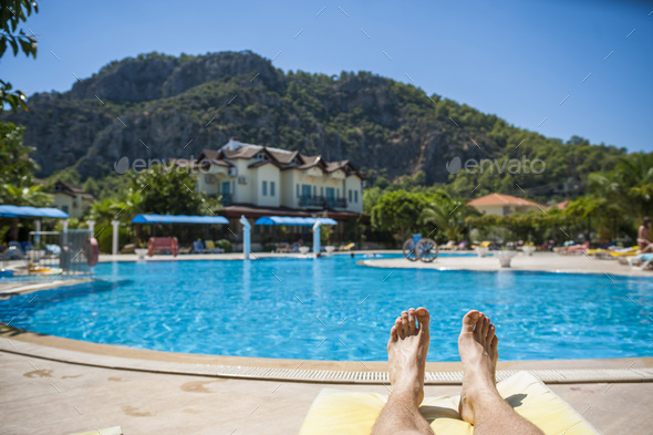 Sunbathing at a swimming pool at a resort in Dalyan, Mugla Province ...