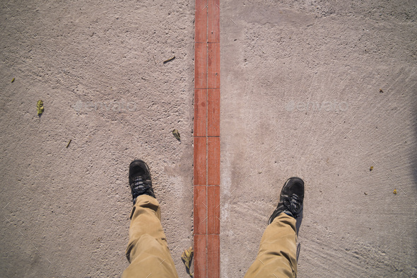 One foot on either side of the Equator at the 'Middle of the World ...