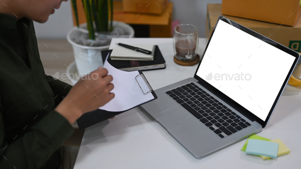 Cropped shot startup small business working with laptop computer at ...