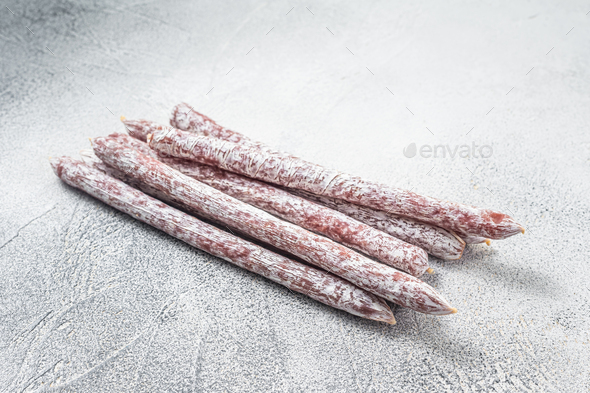 Traditional Spanish mini fuet sausage. White background. Top view Stock ...