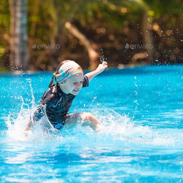 Little happy adorable girl in outdoor swimming pool Stock Photo by ...